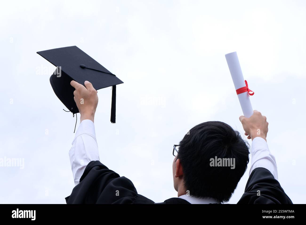 Student with congratulations, graduates wearing a graduation gown of ...