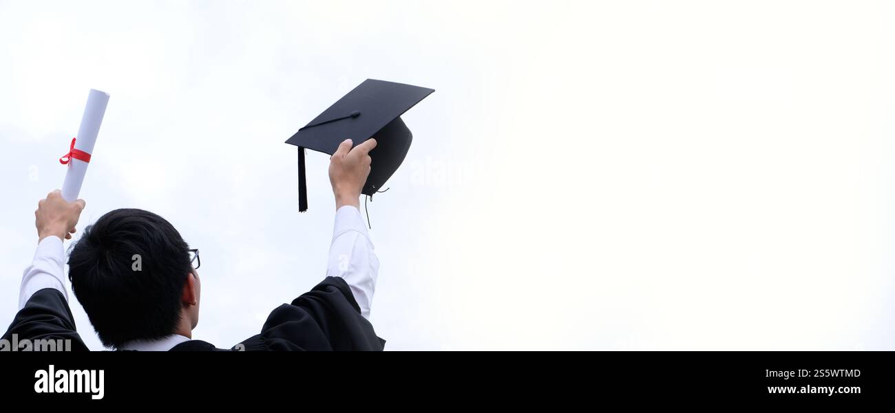 Student with congratulations, graduates wearing a graduation gown of ...