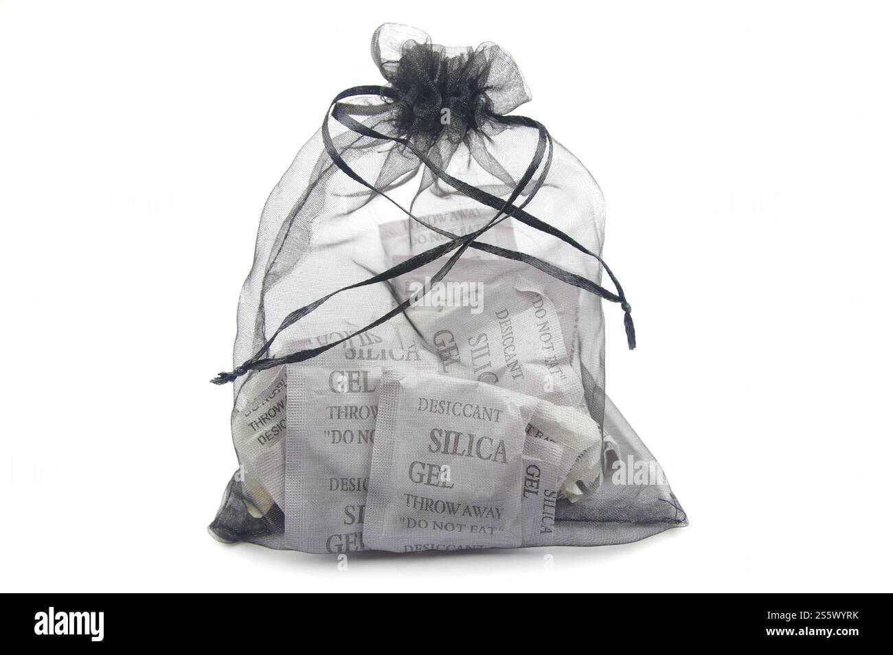 black mesh bag with silica gel paper bags inside on a white backdrop ...