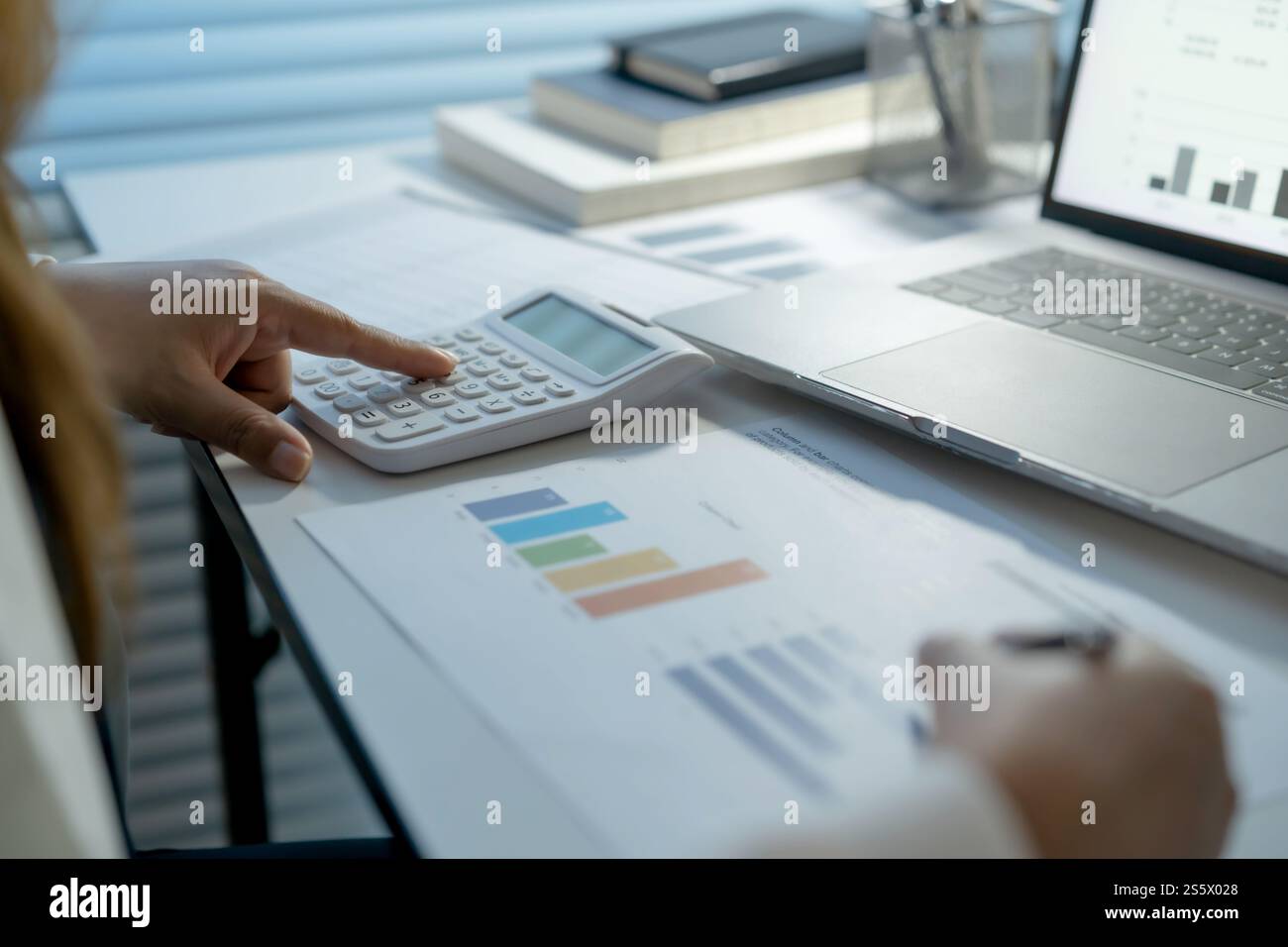 Alone Working Late at Night. Asian business woman at workplace in ...
