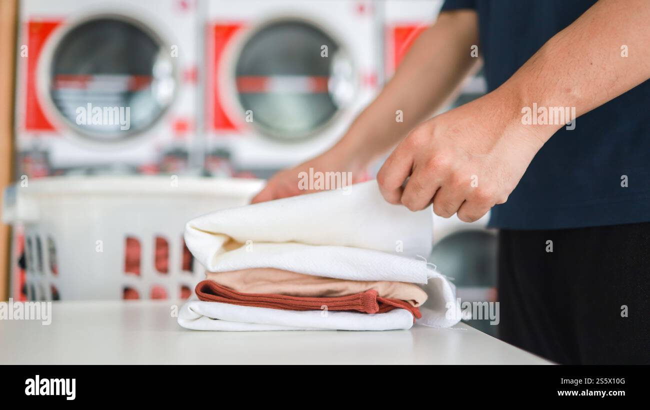 Man doing launder holding basket with dirty laundry of the washing ...