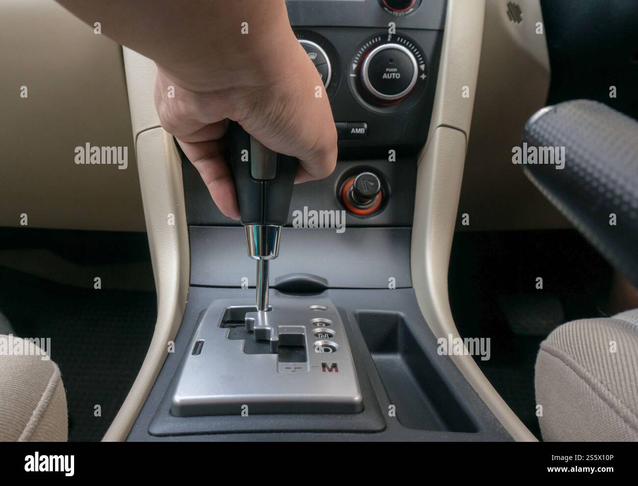 Man driving hands changing gear while driving in the car selective ...