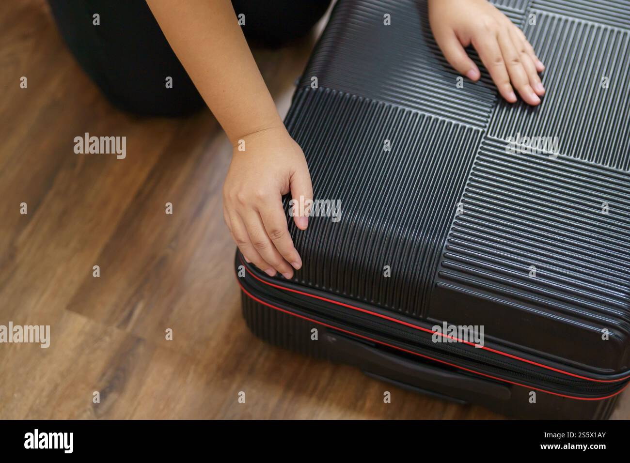 Woman preparing luggage packing in suitcase trolley luggage traveling ...