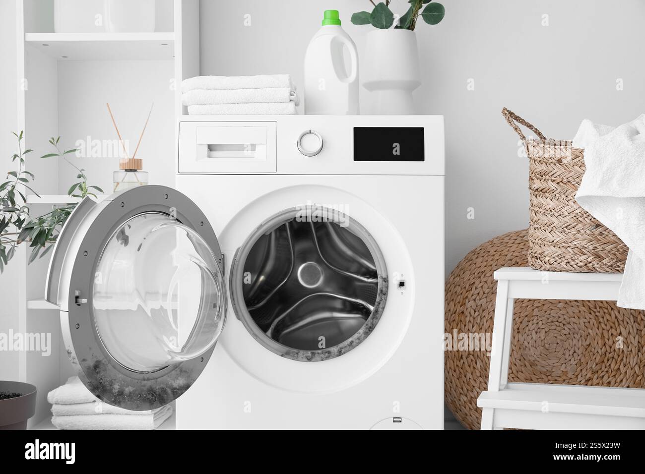 Washing machine with black mold in laundry room Stock Photo - Alamy