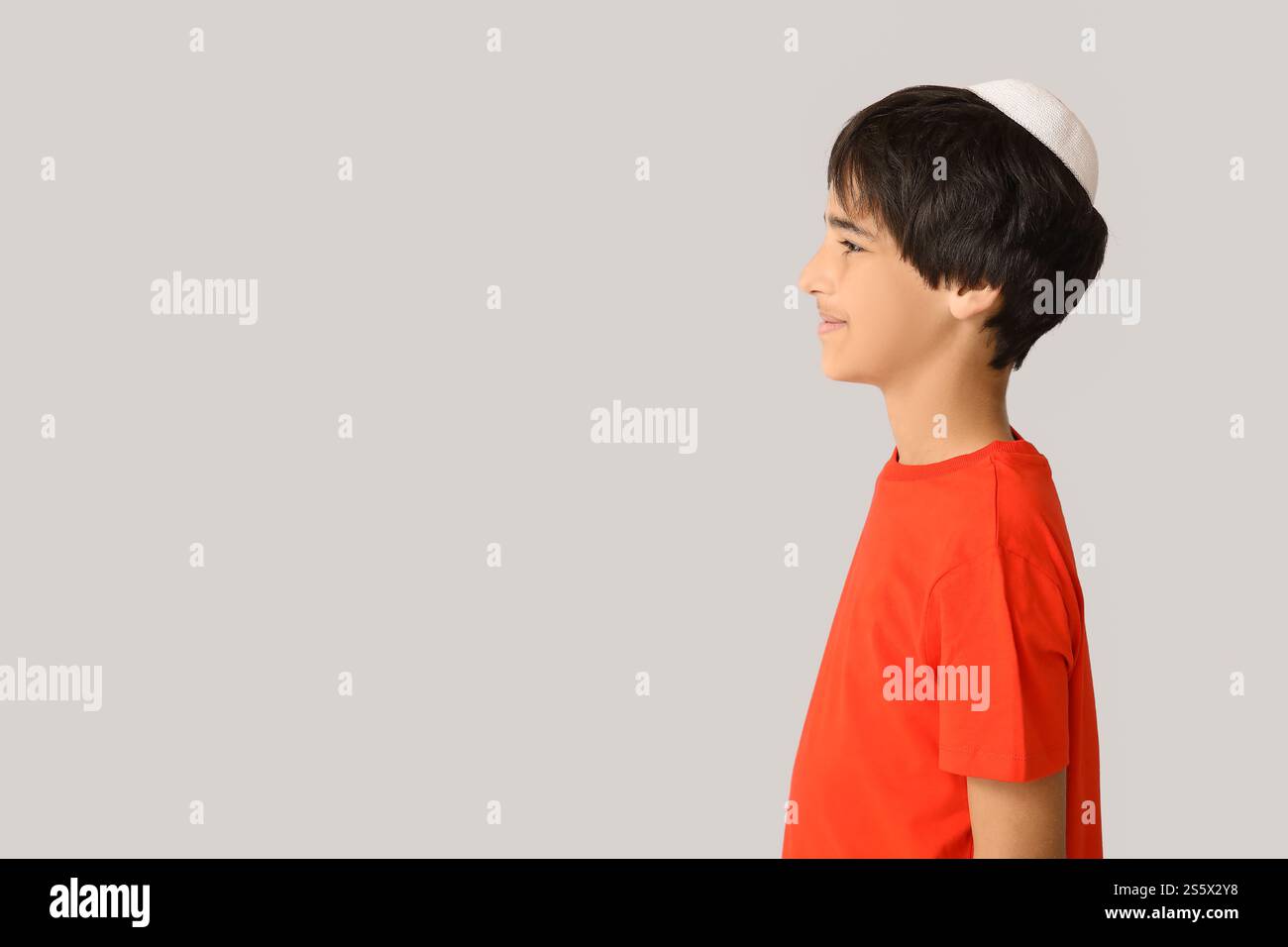Little Israeli boy in kipa on grey background Stock Photo - Alamy