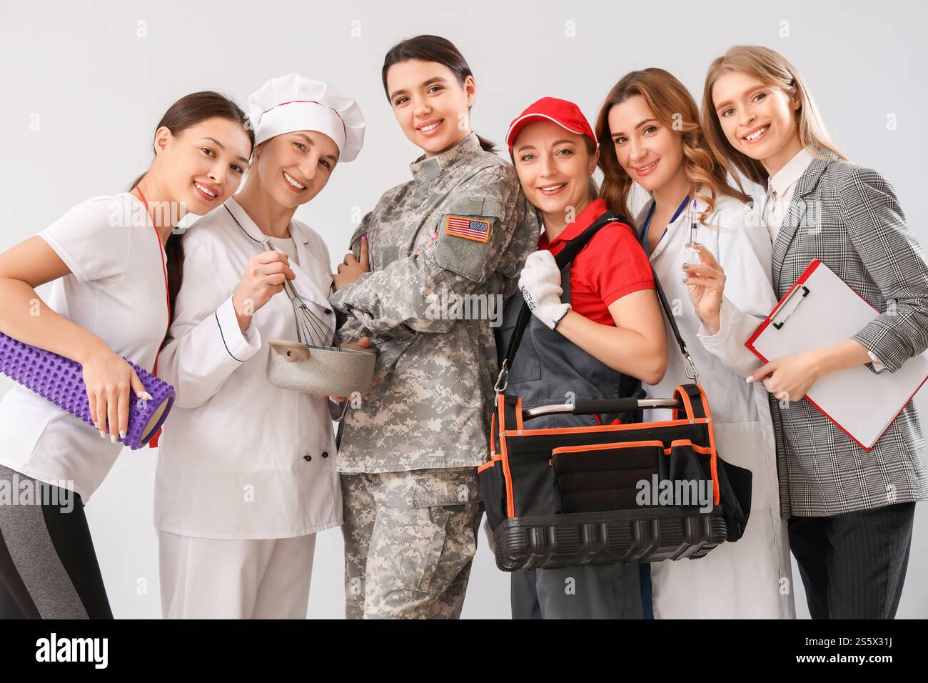 Women of different professions on grey background Stock Photo - Alamy