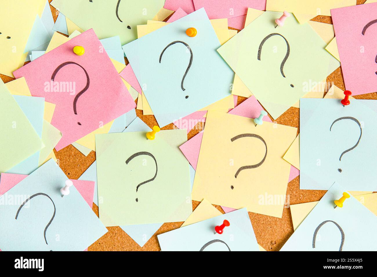 Many sticky notes with question marks pinned on board Stock Photo - Alamy