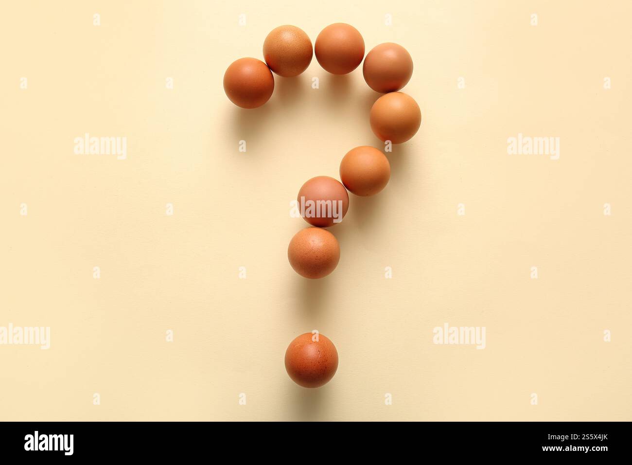 Question mark made of fresh chicken eggs on color background Stock ...