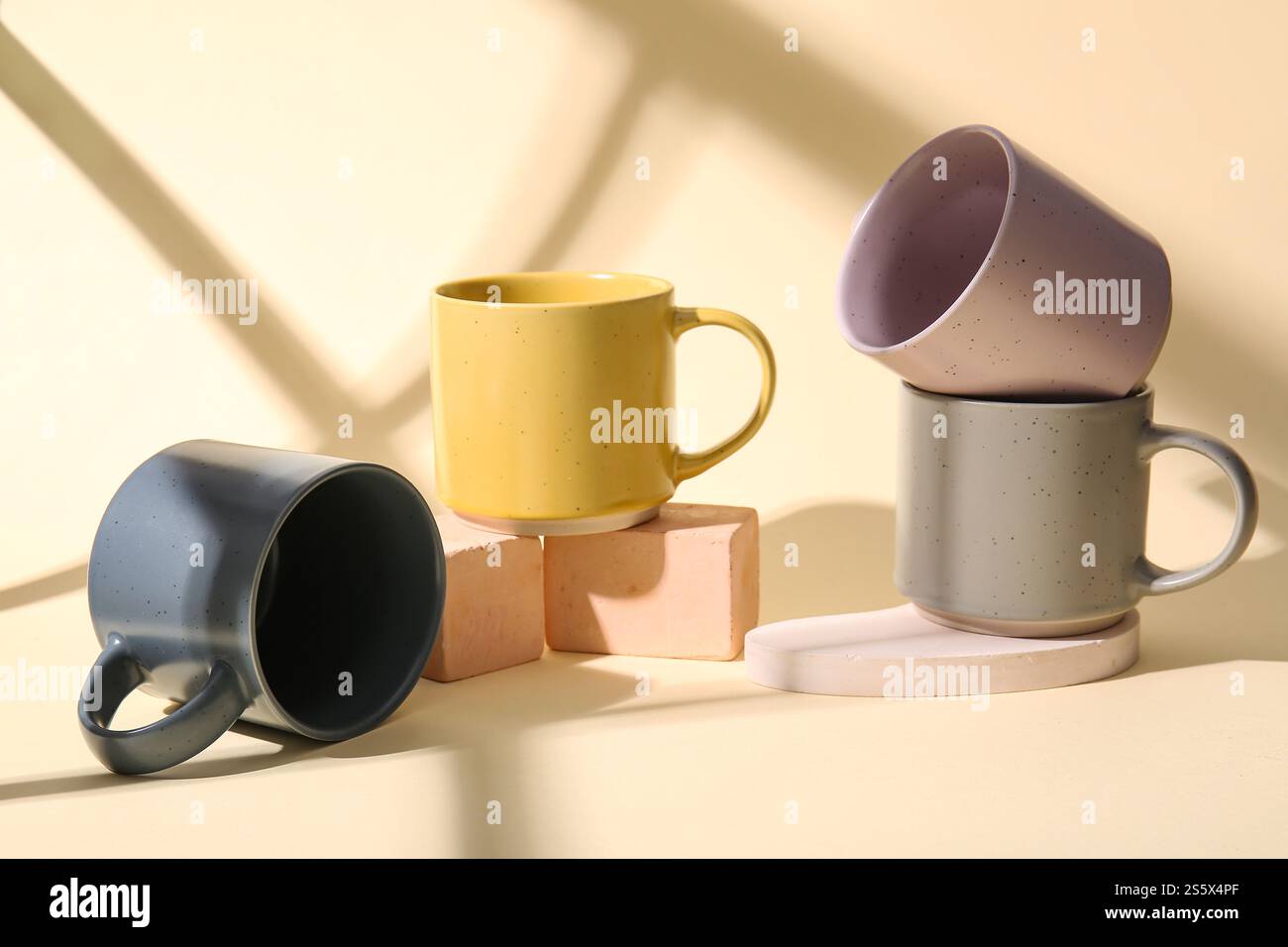 Set of different ceramic mugs on color background Stock Photo - Alamy