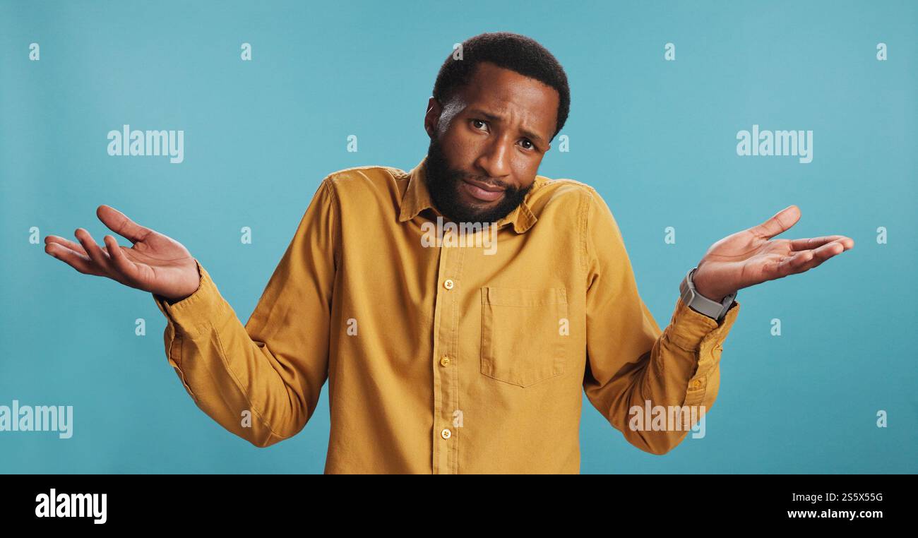 Portrait, confused black man and shrug in studio for choice, decision ...