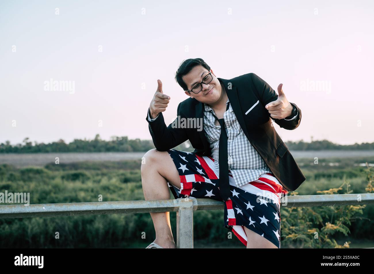 Young funny Asian Businessman wearing shirt and tie with shorts and ...