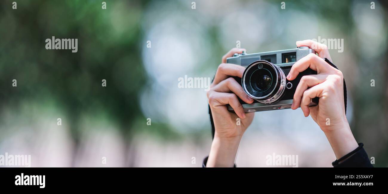 Close up and selective focus Hands of Female Professional photographer ...