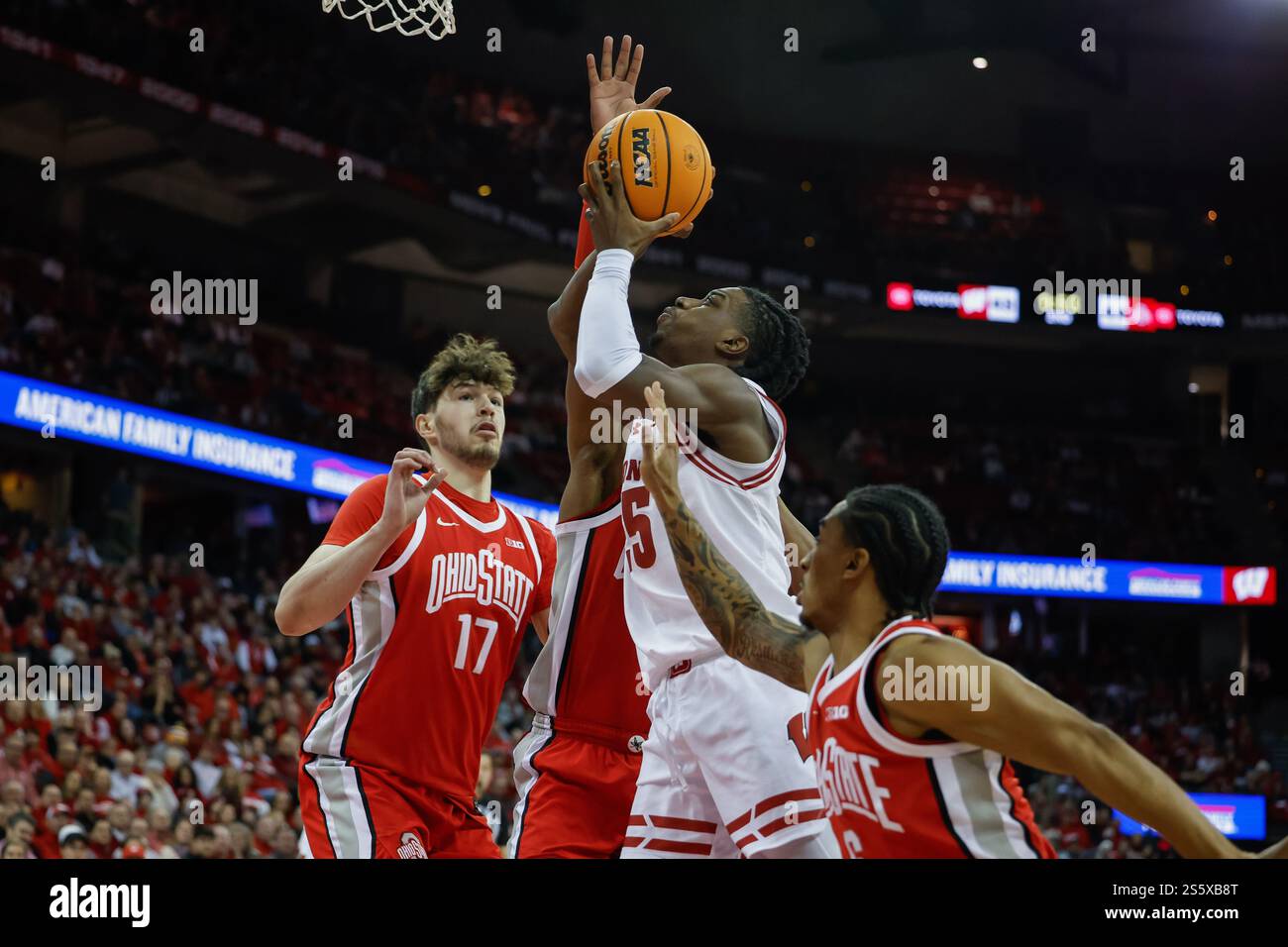 Madison, WI, USA. 14th Jan, 2025. Wisconsin Badgers guard John Blackwell (25) makes a layup in a ...