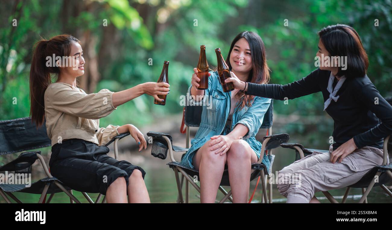 Group beautiful Asian women friends travelers relaxing in camp chairs ...