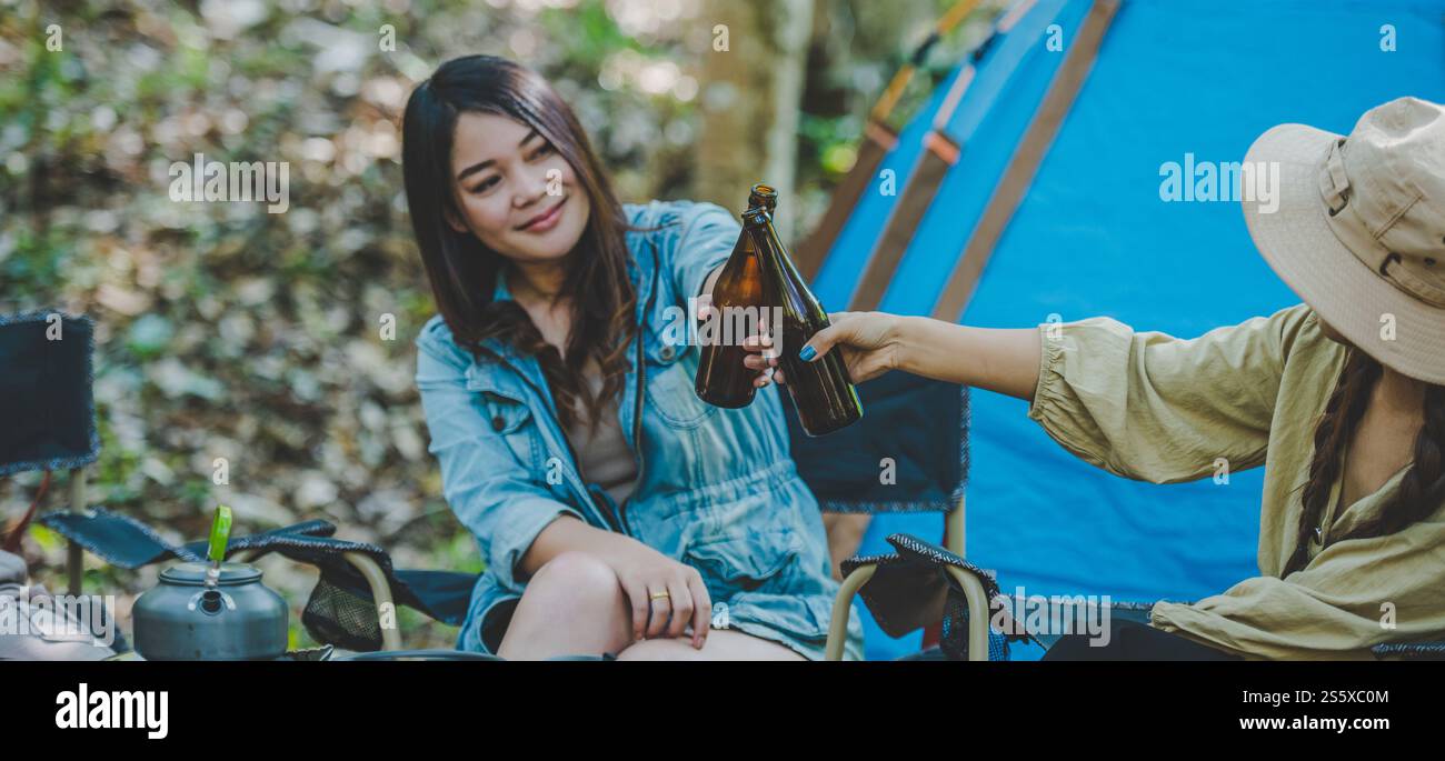 Group beautiful Asian women friends travelers relaxing in camp chairs ...