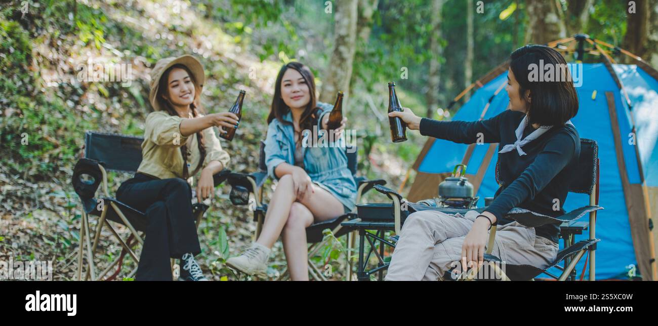 Group beautiful Asian women friends travelers relaxing in camp chairs ...