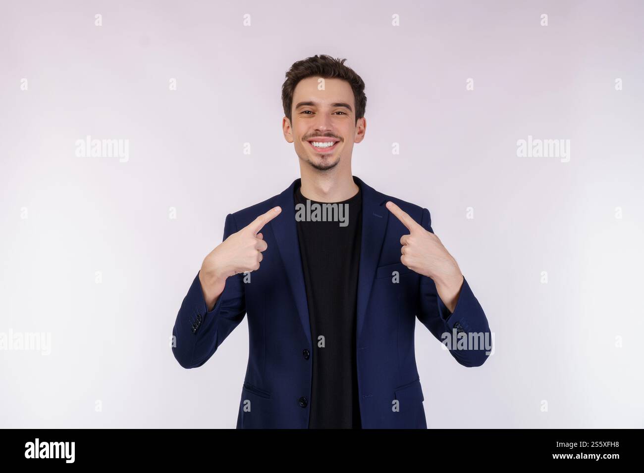 Portrait of attractive cheerful young man pointing finger at himself ...