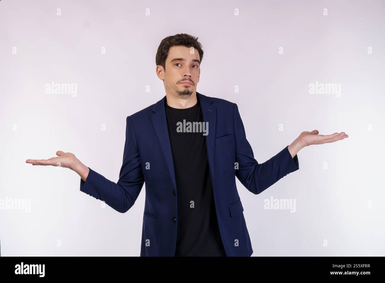 Portrait of puzzled clueless young businessman arms out asking why ...