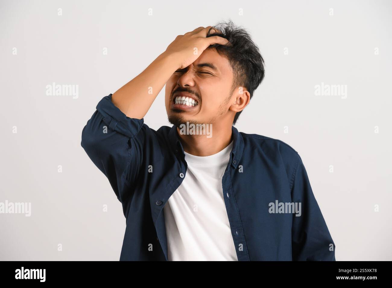 Portrait of Disappointed young asian man in blue shirt annoyed angry in ...