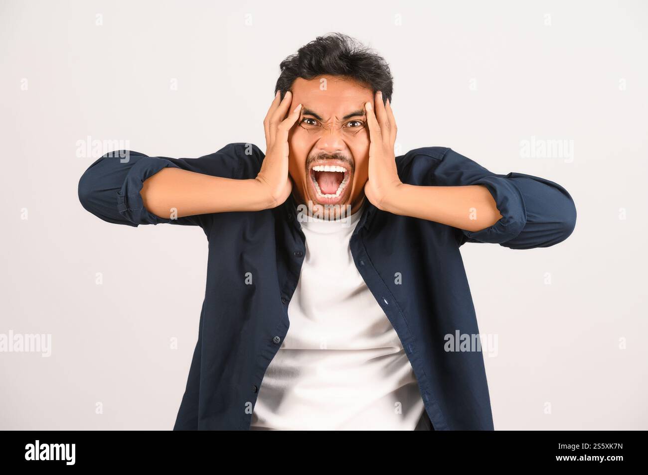 Portrait of Disappointed young asian man in blue shirt annoyed angry in ...