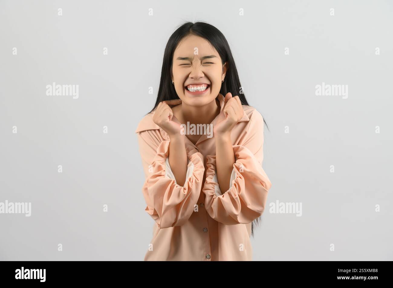 Portrait of Happy young asian woman in pink shirt exciting isolated on ...