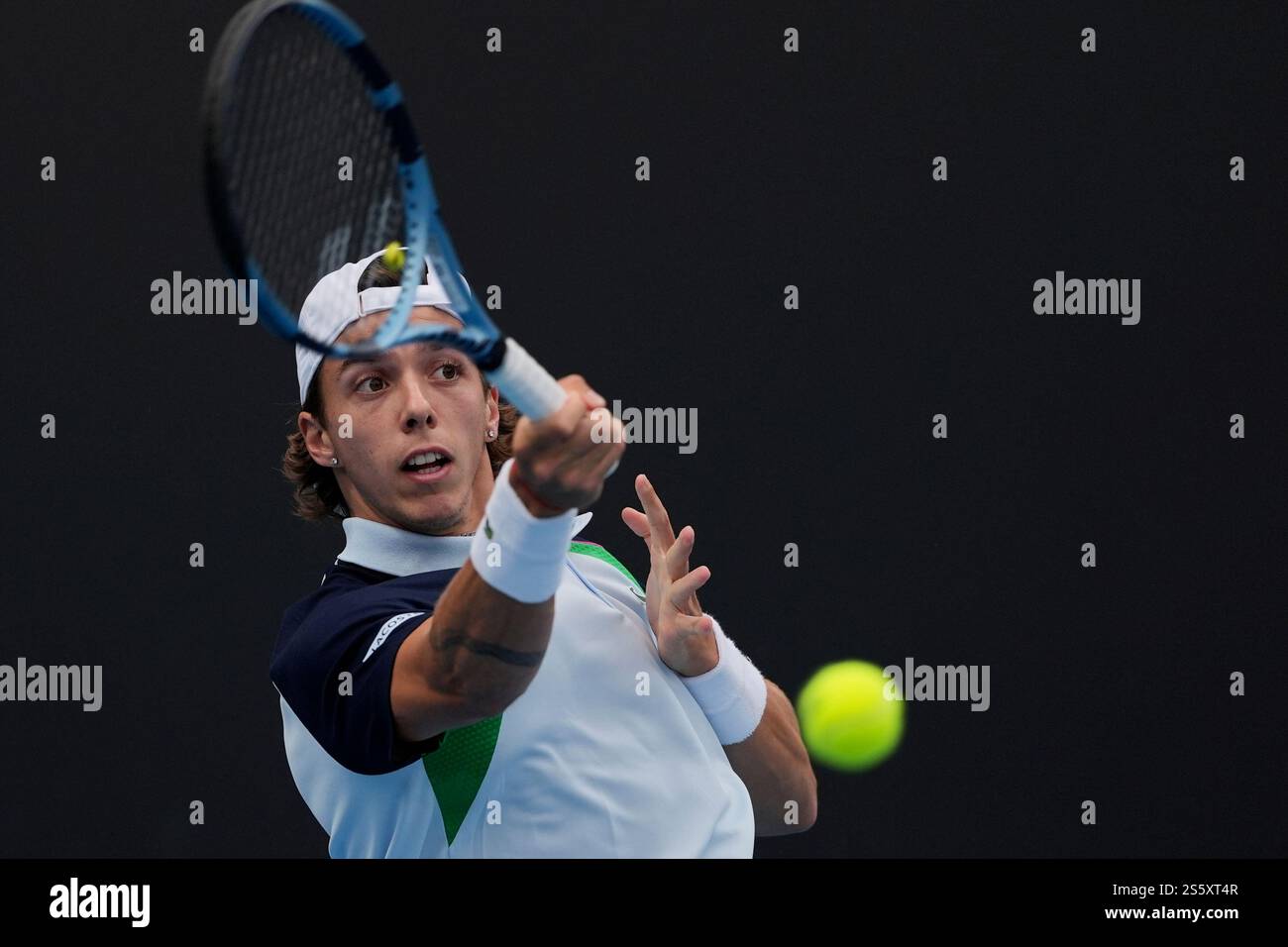 Arthur Cazaux of France plays a forehand return to Jacob Fearnley of ...
