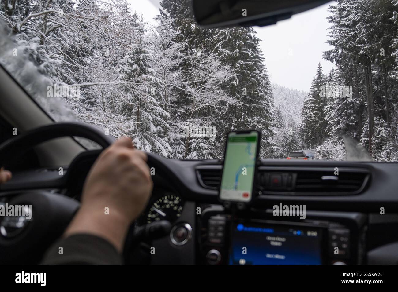 Driving in Snowy Conditions with Navigation Stock Photo - Alamy
