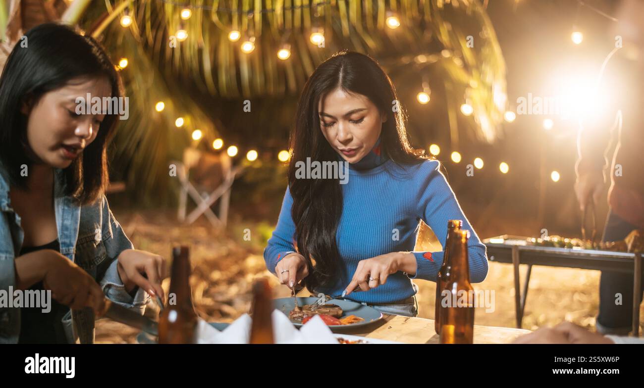 Happy Asian friends cheering with roasted turkey dinner outdoor - Group ...