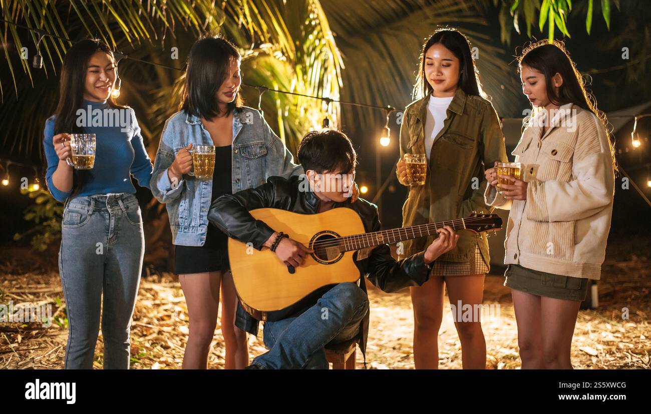 Portrait of Happy Asian group of friends having fun to music dining and ...