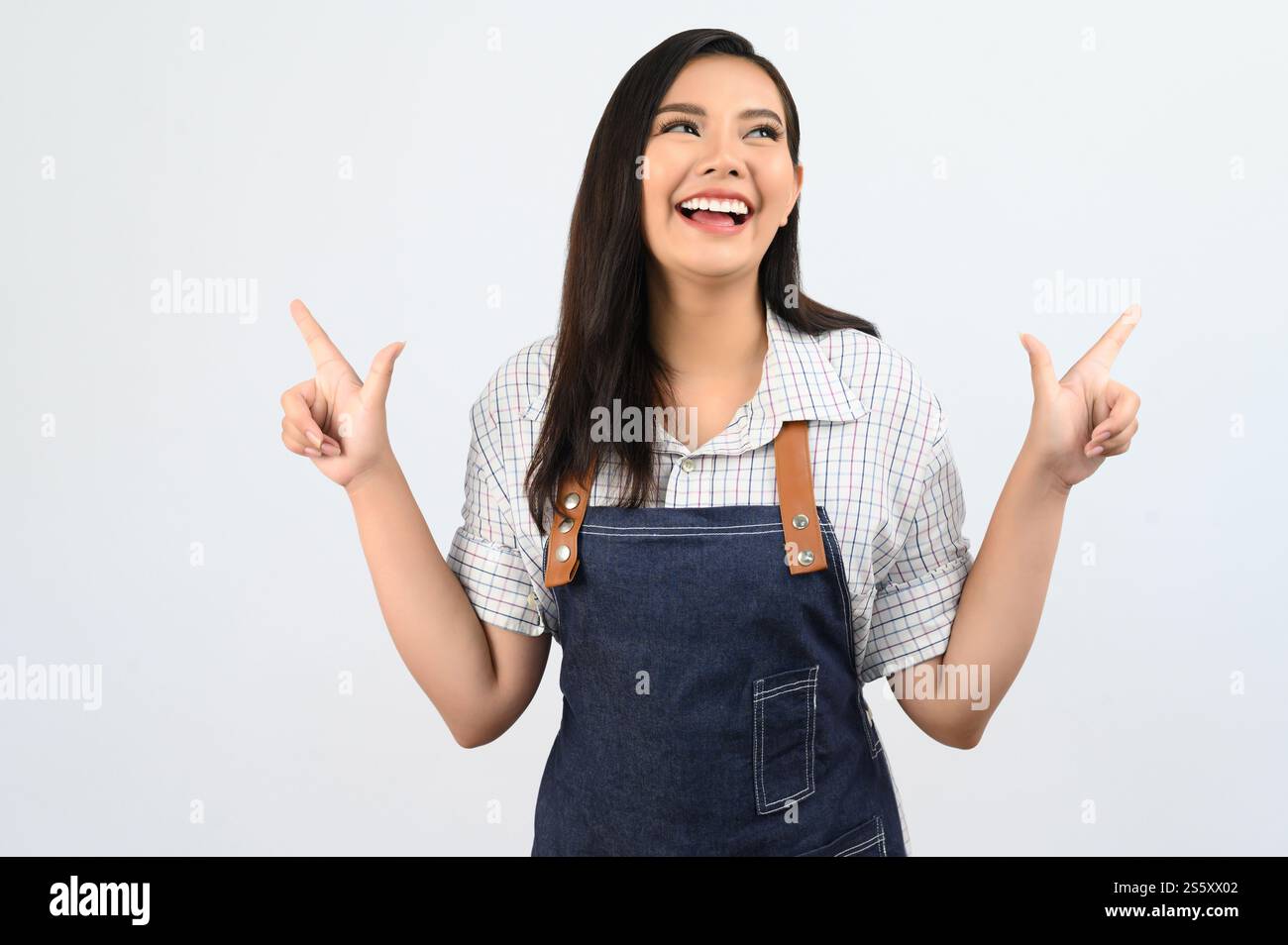 Portrait Asian young woman smile with happy in waitress uniform and ...