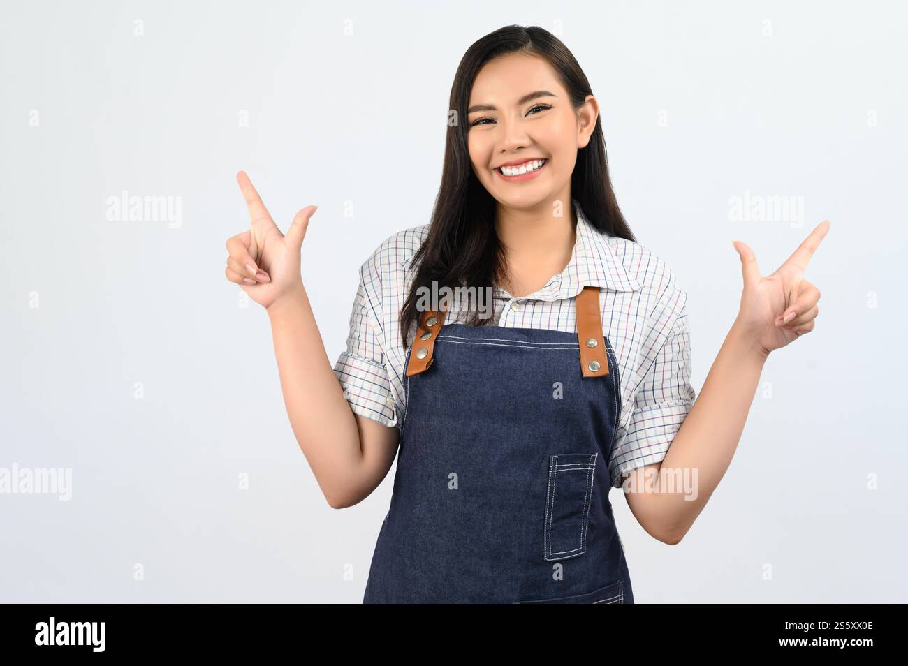 Portrait Asian young woman smile with happy in waitress uniform and ...