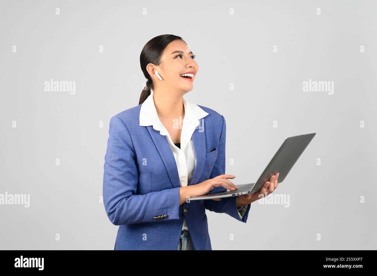 Portrait Asian young woman in officer uniform standing posture talking ...