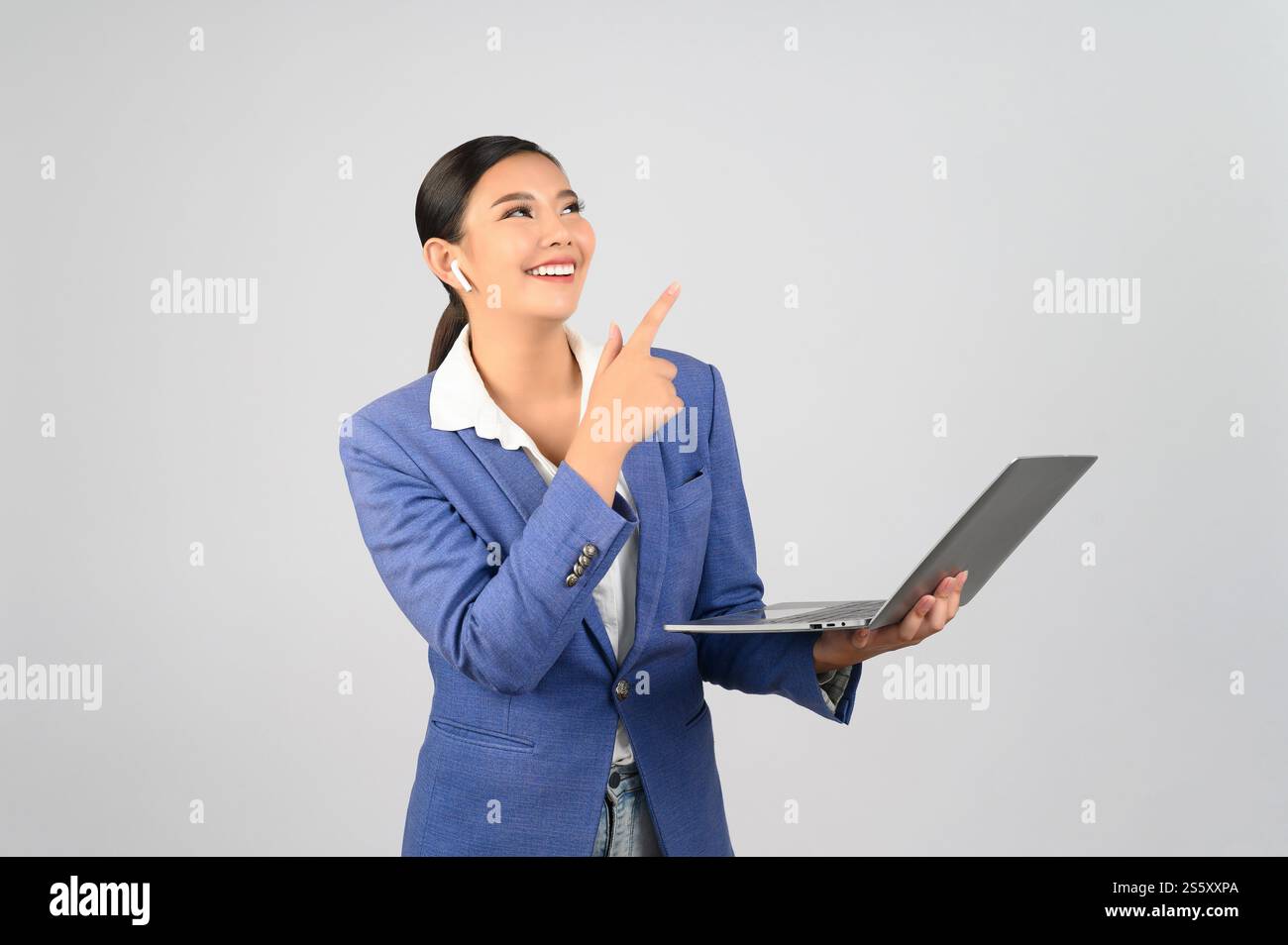 Portrait Asian young woman in officer uniform standing posture talking ...