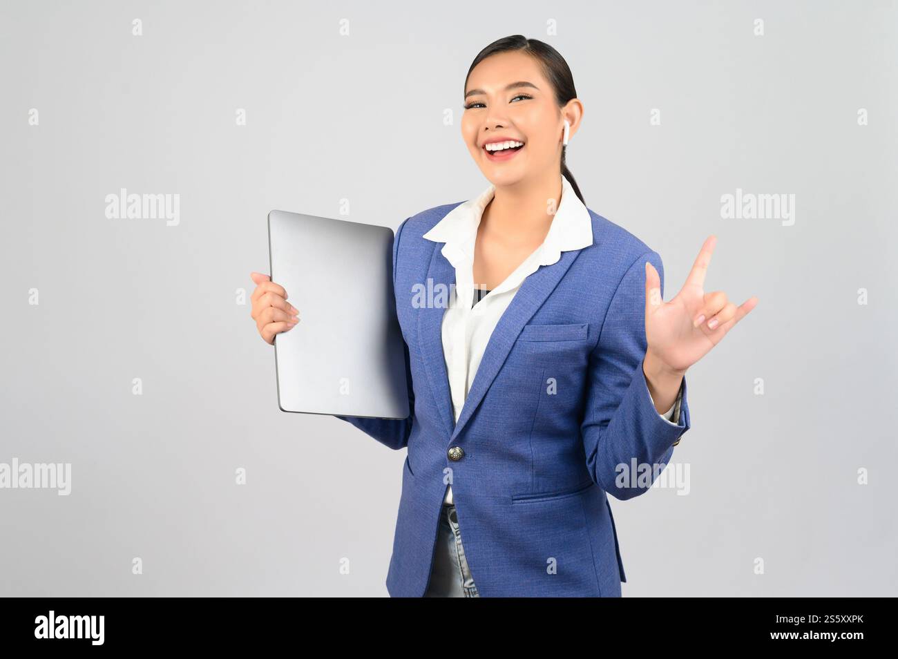 Portrait Asian young woman in officer uniform standing posture talking ...