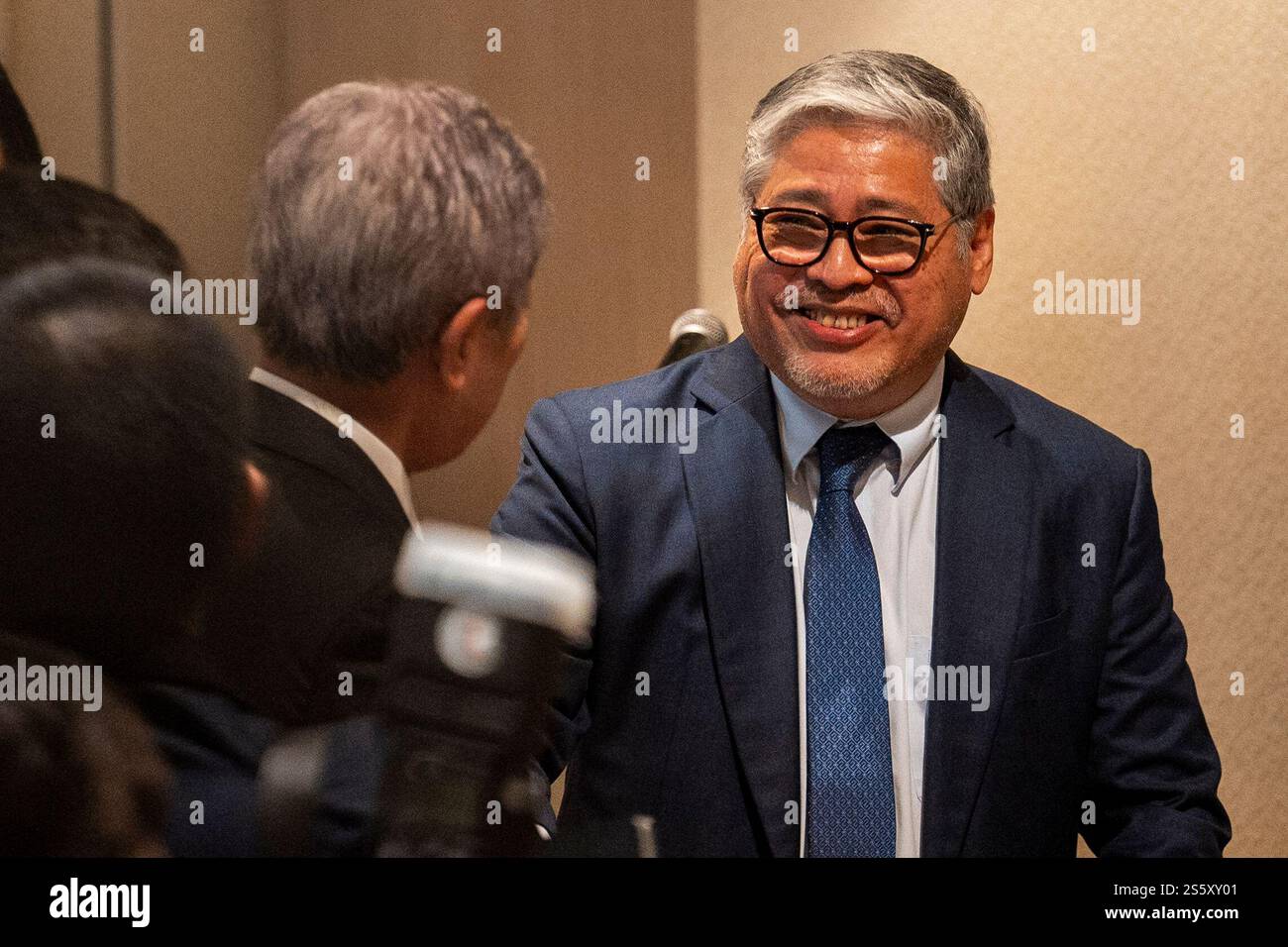 Philippine Foreign Secretary Enrique Manalo, right, reacts after a ...