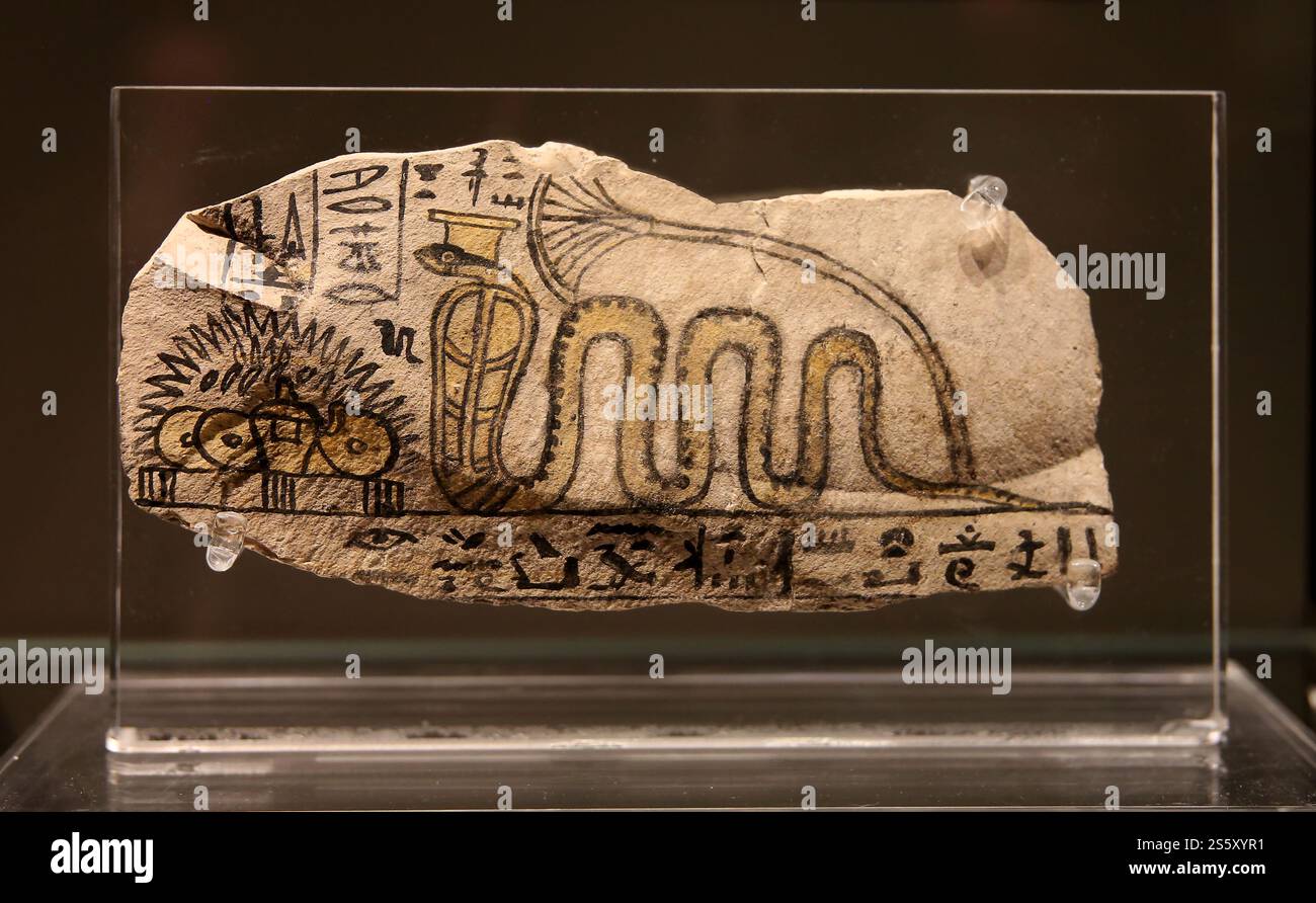 Ostrakon dedicated to Meretseger by Amenkhau. The Goddess is in front ...