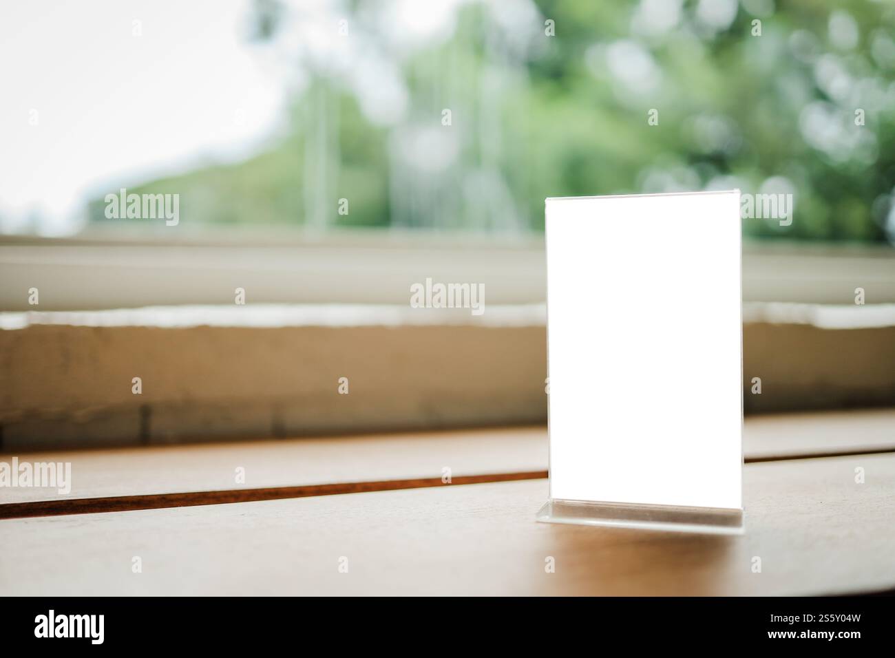 Menu frame standing on wood table in Bar restaurant cafe. space for ...
