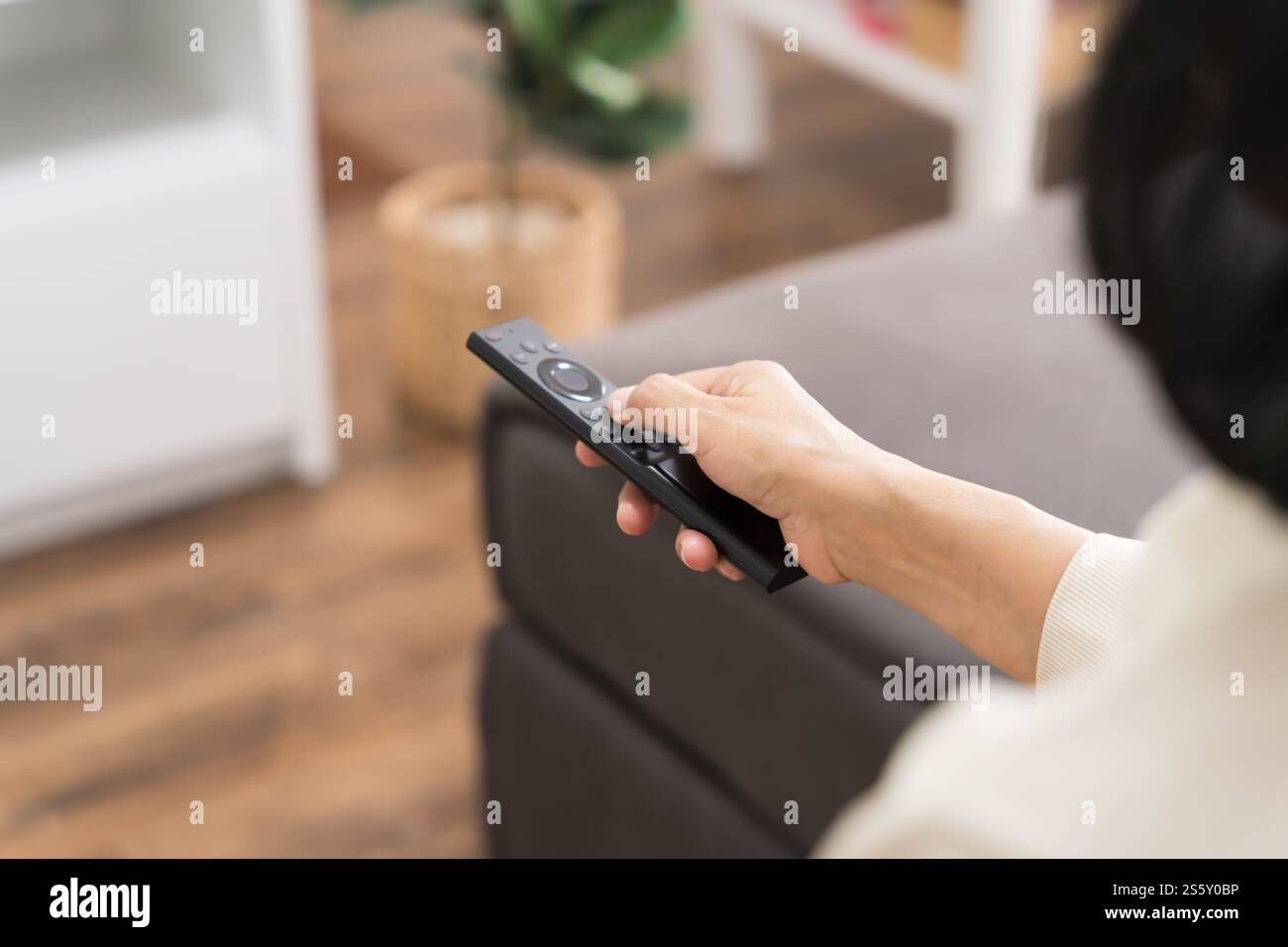 Elderly woman Watching smart TV and using remote controller Hand ...