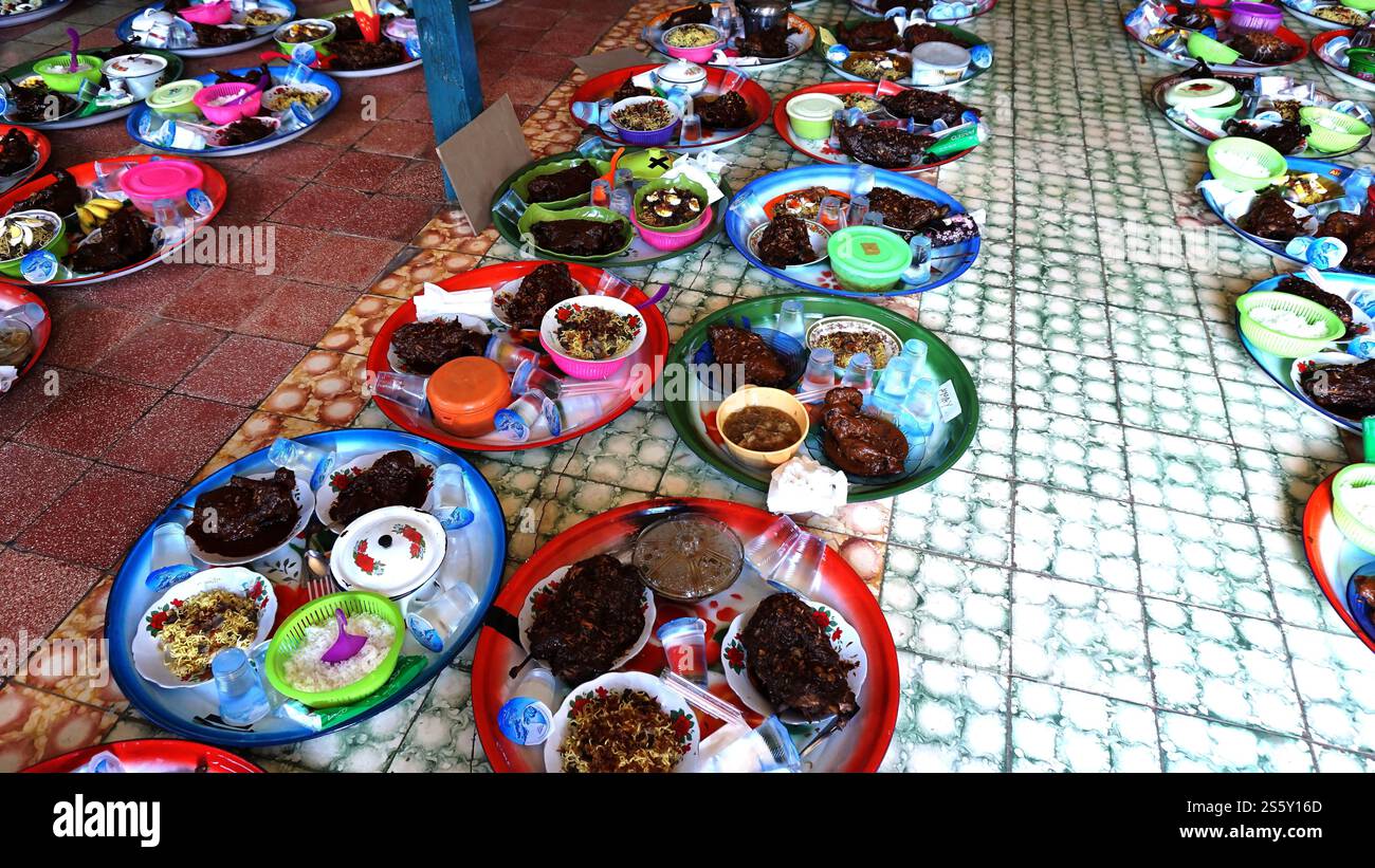Colorful trays filled with various traditional dishes and desserts ...