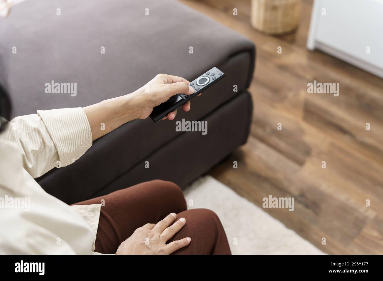 Elderly woman Watching smart TV and using remote controller Hand ...