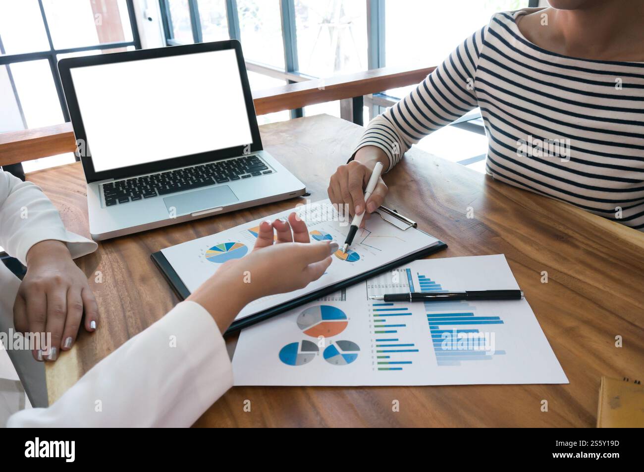 Team leader coach teach young workers explain on paper for business ...