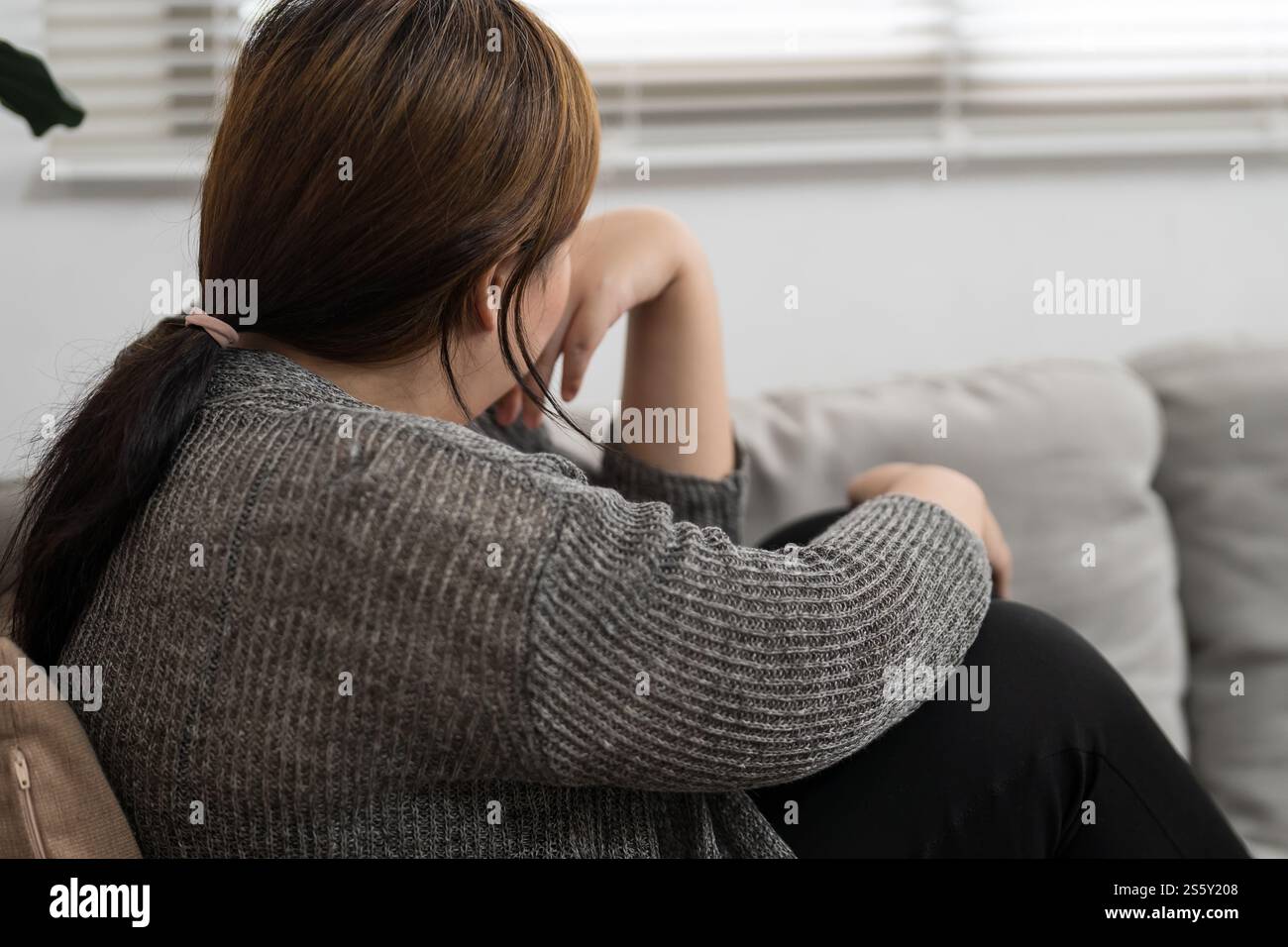 Sad Overweight plus size woman thinking about problems on sofa upset ...