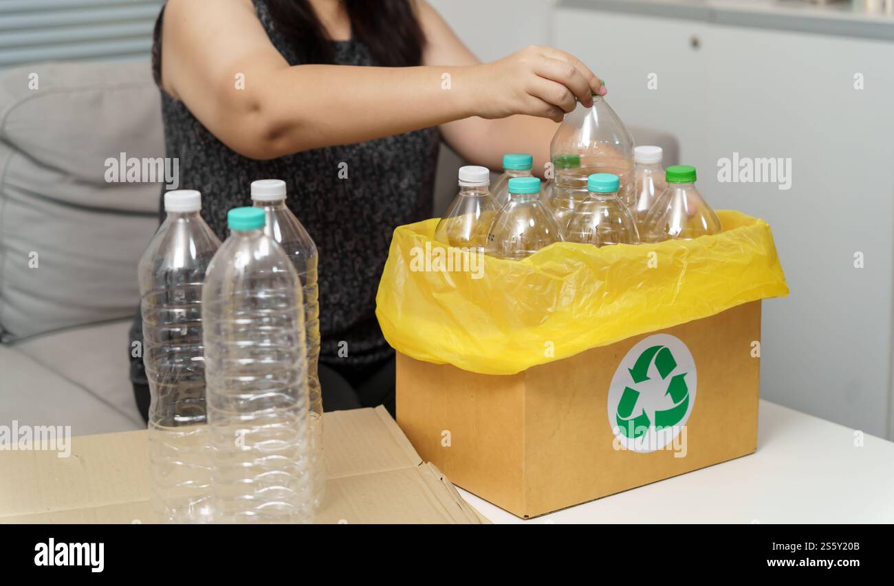Home recycle eco green zero concept Woman throwing empty plastic bottle ...