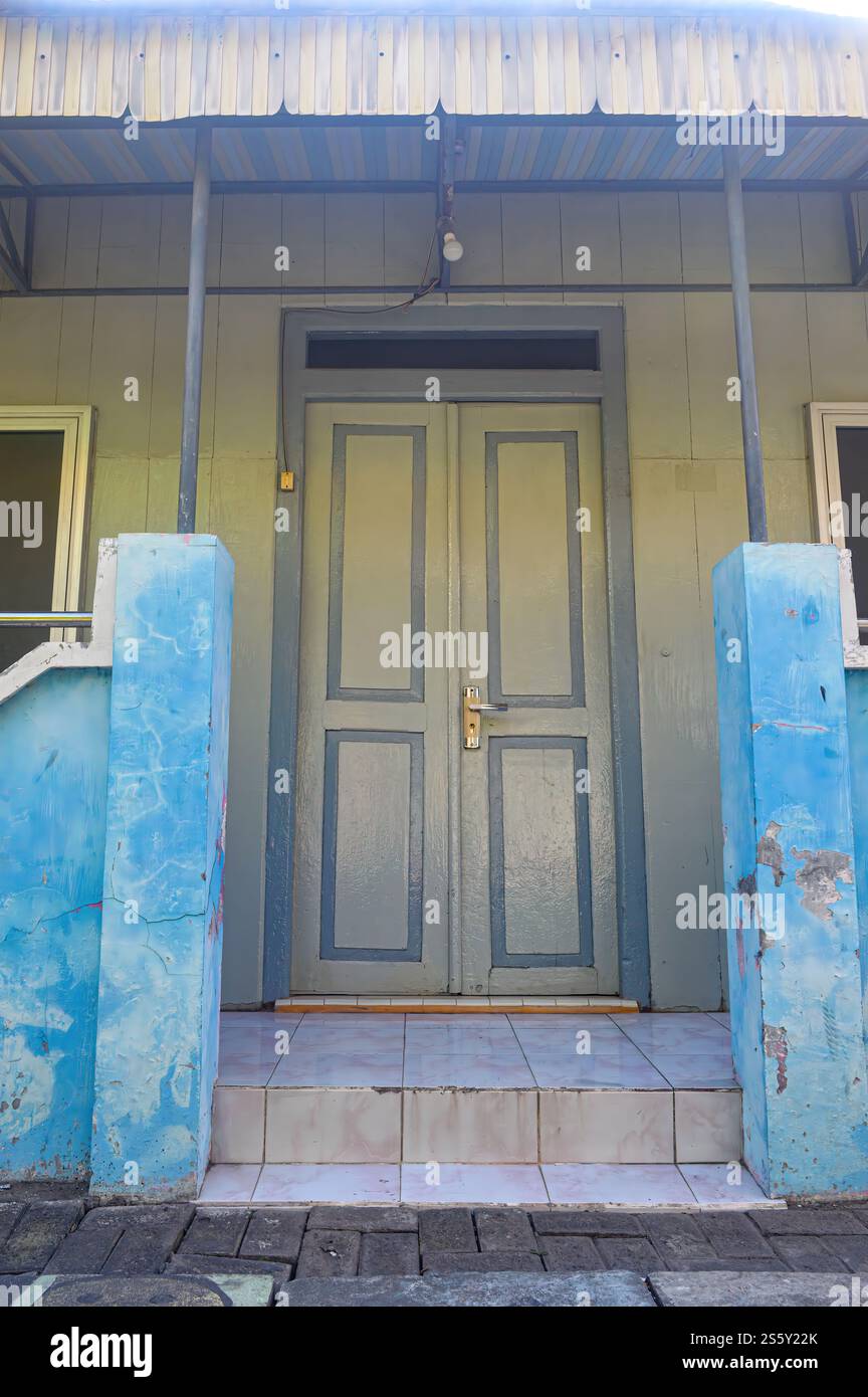 the front door of a Dutch East Indies style house in Indonesia.the ...