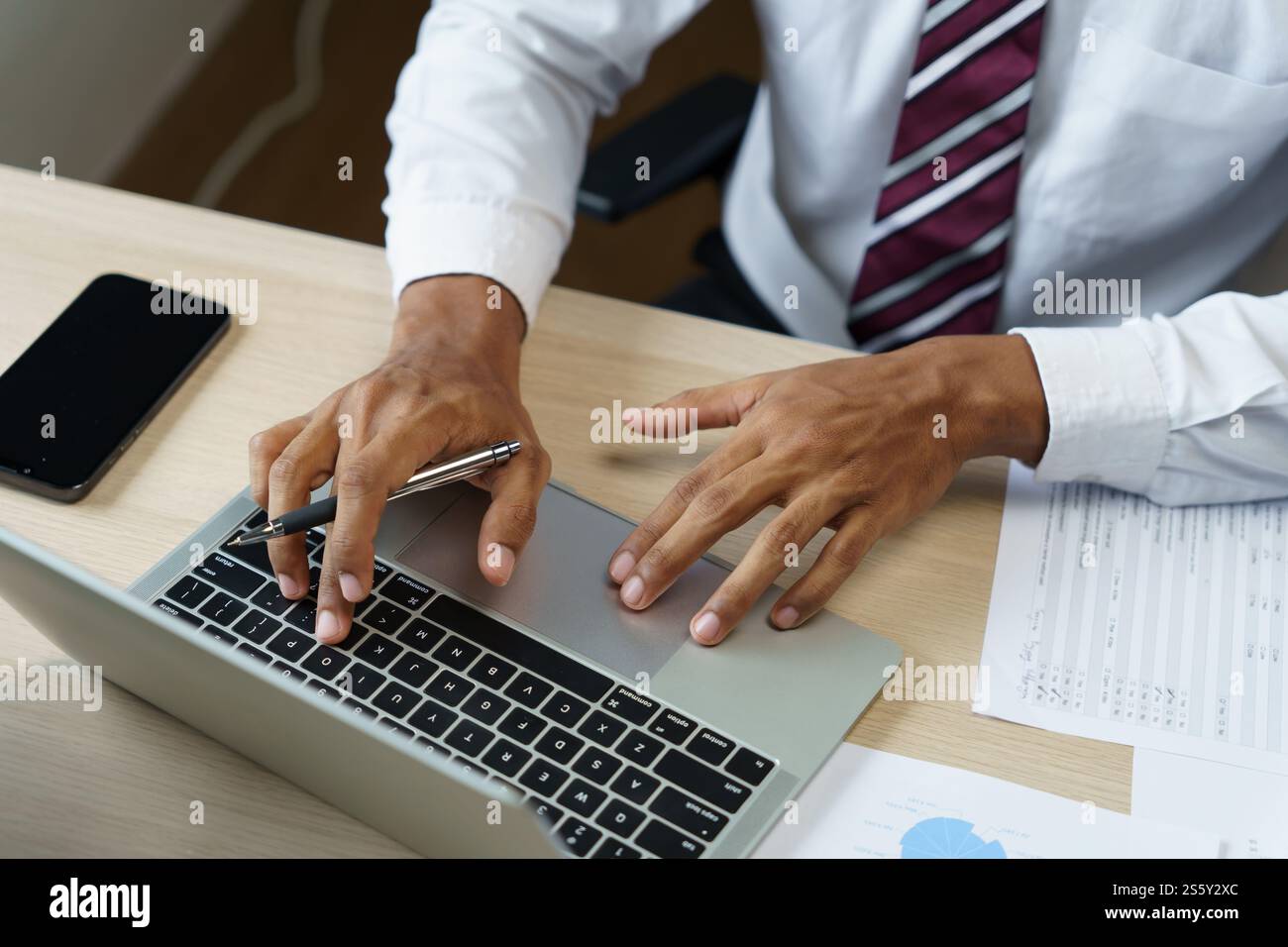 Man working by using a laptop computer Hands typing on keyboard ...