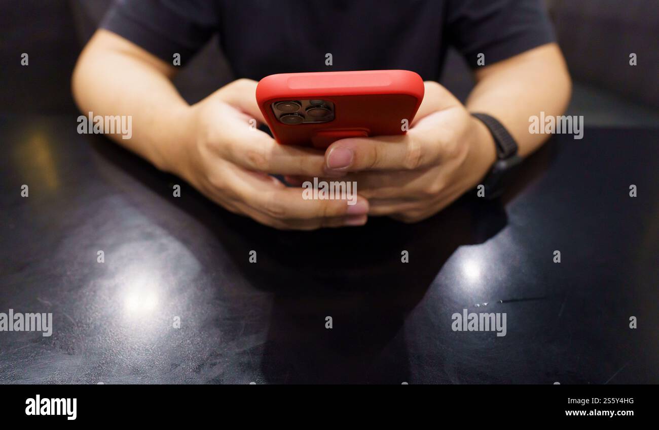Man playing game on mobile phone. gamer boy playing video games holding ...