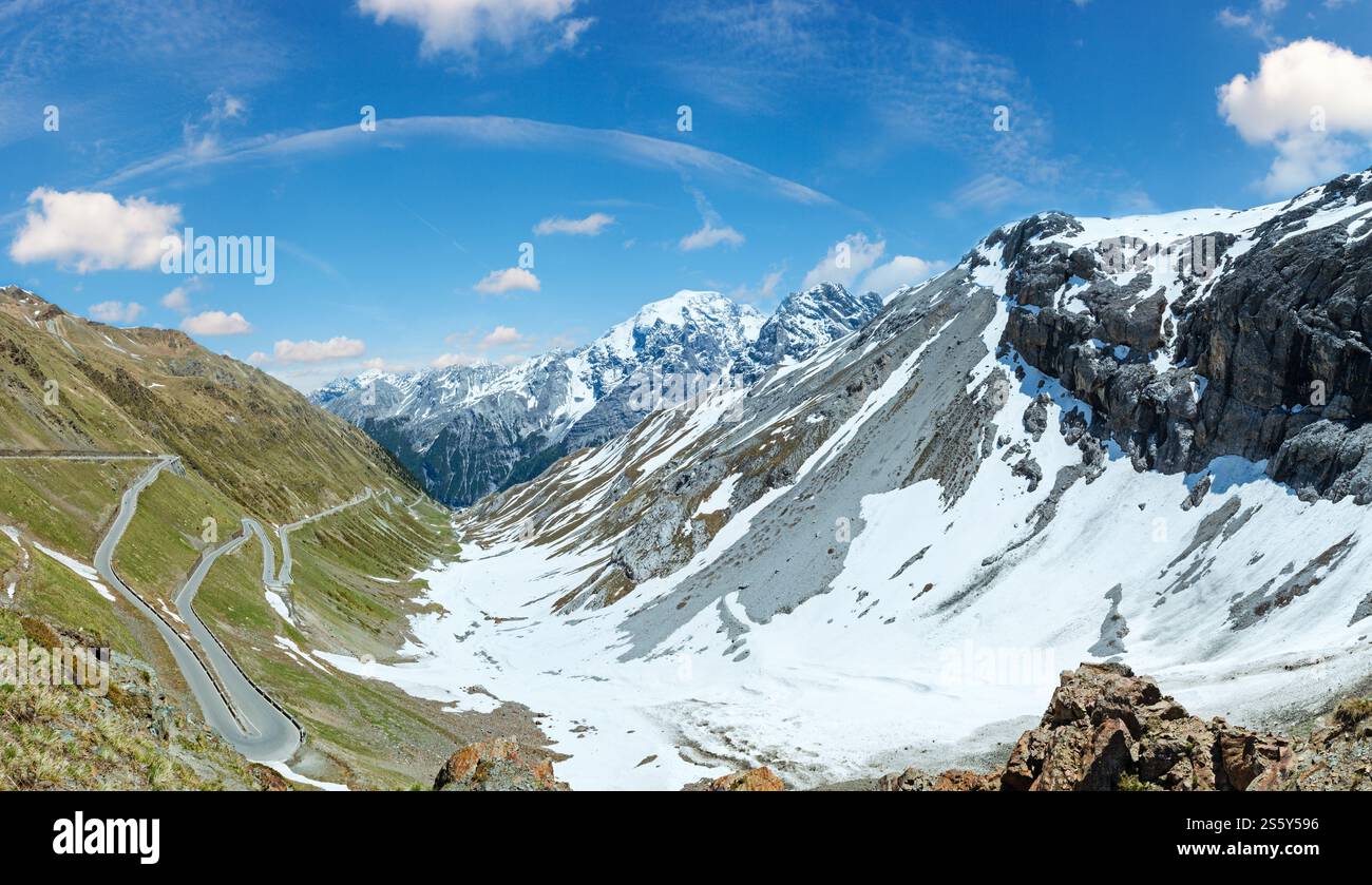 Summer Stelvio Pass panorama with snow on mountainside and serpentine ...