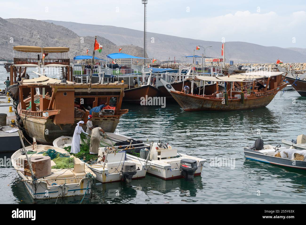 Khasab, Oman - January 1, 2025: Traditional wooden dhows and small ...