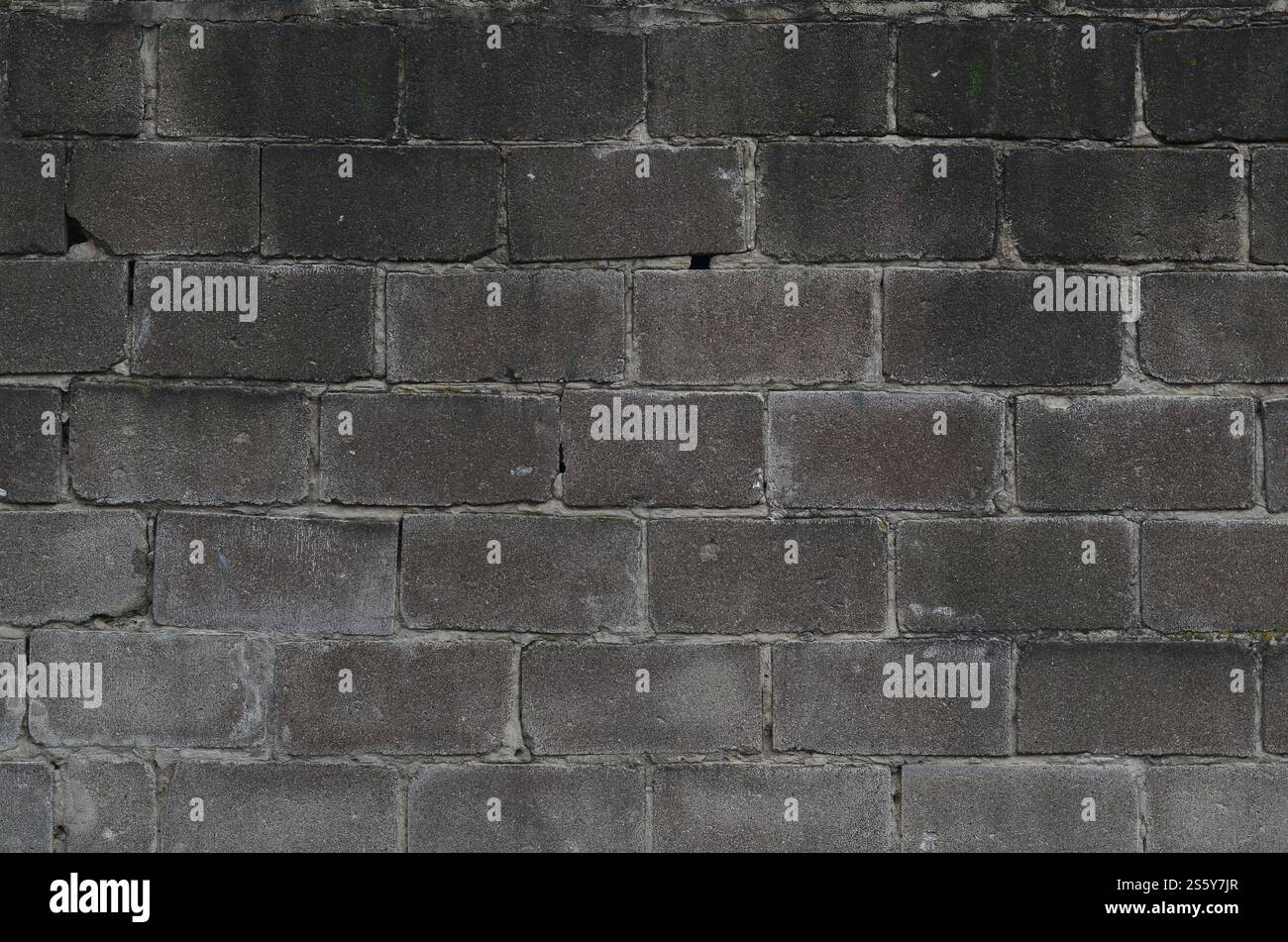 Weathered stained old block wall background. Texture of an old wall of ...