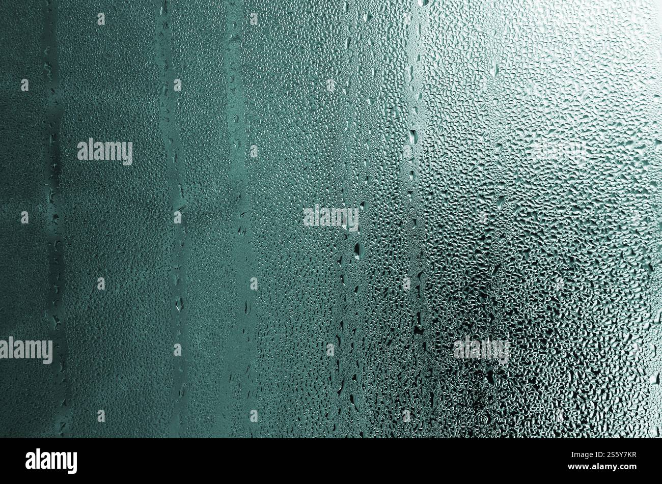 Texture of a drop of rain on a glass wet transparent background. Toned ...